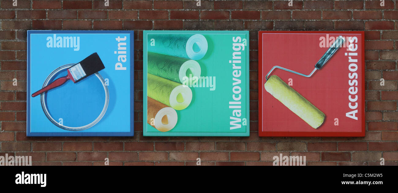 Advertising signs on brick wall Stock Photo - Alamy