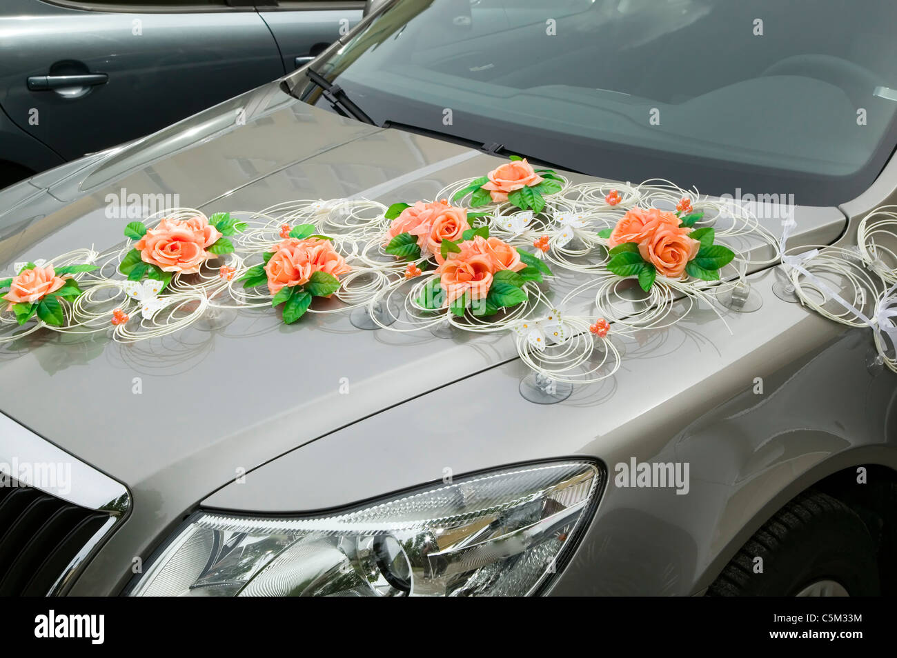 Car with decorations from flower for driving bride and groom during ...