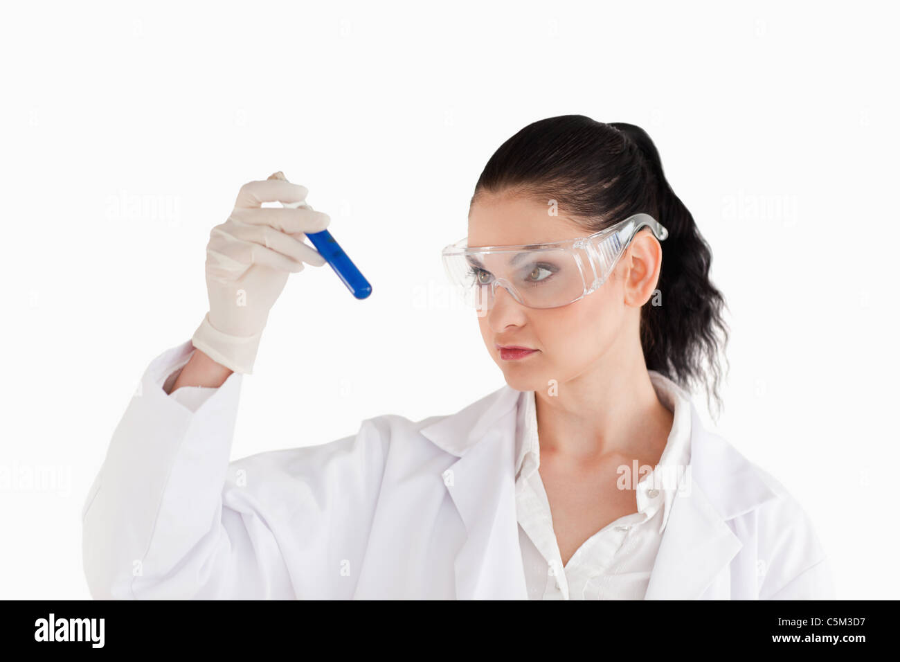 Dark-haired scientist carrying out an experiment Stock Photo - Alamy