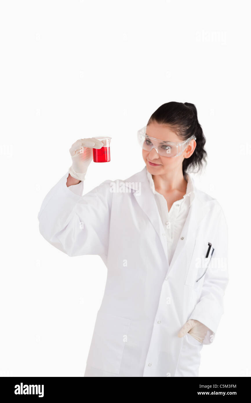 Scientist looking beaker red hi-res stock photography and images - Alamy