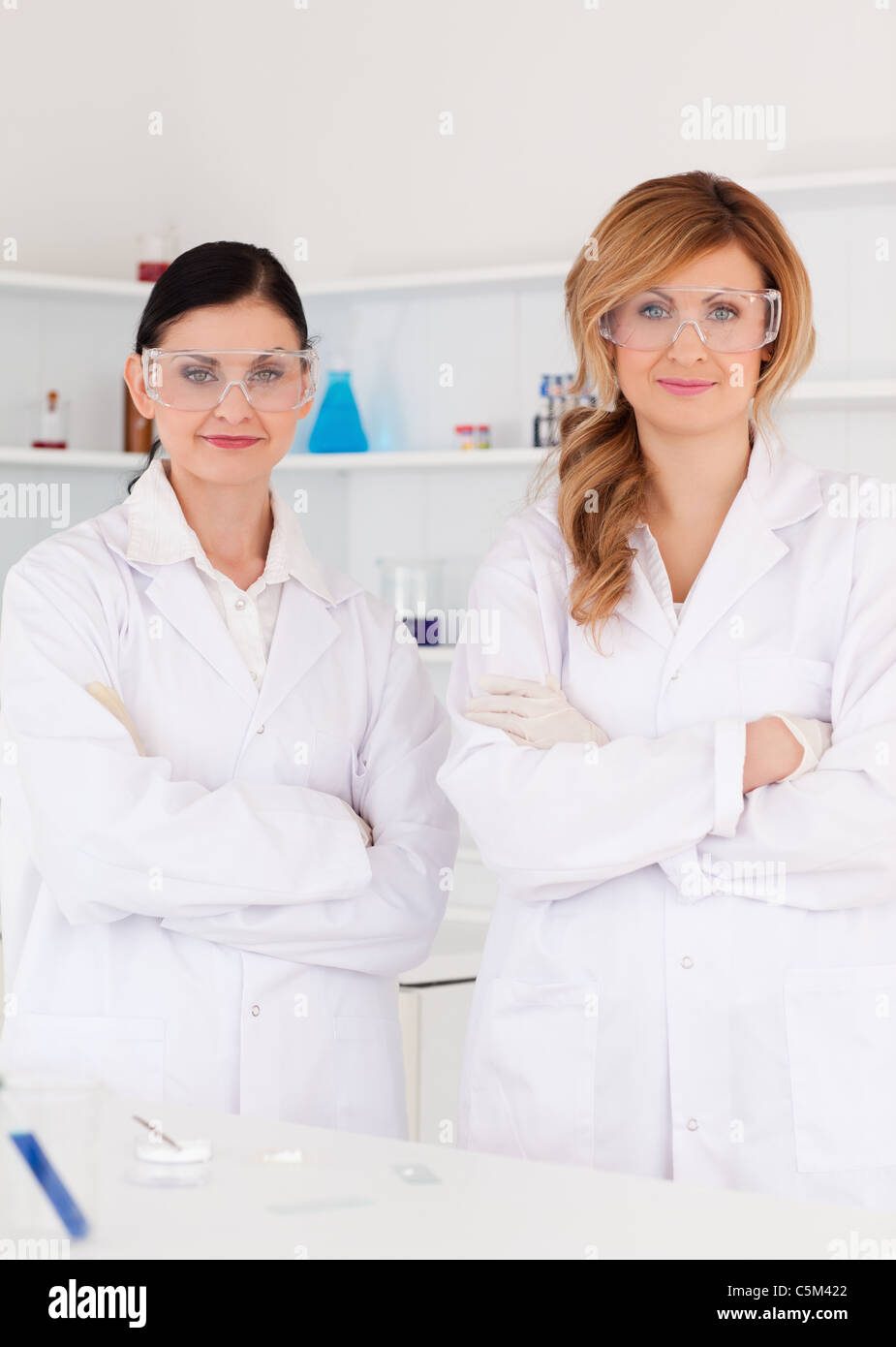 Two female scientists looking at the camera Stock Photo - Alamy