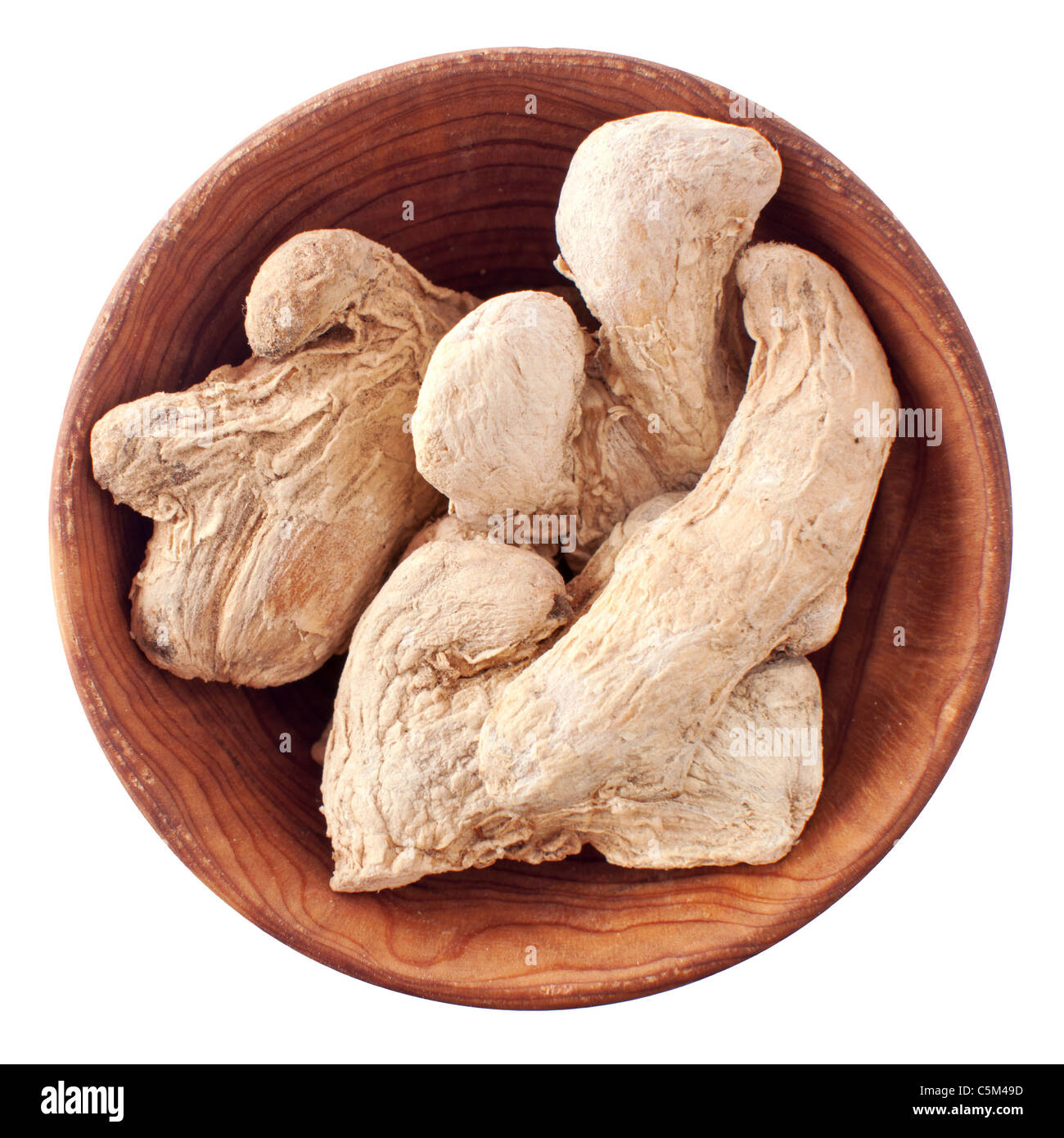 Dry ginger root in a wooden bowl isolated on white background Stock ...