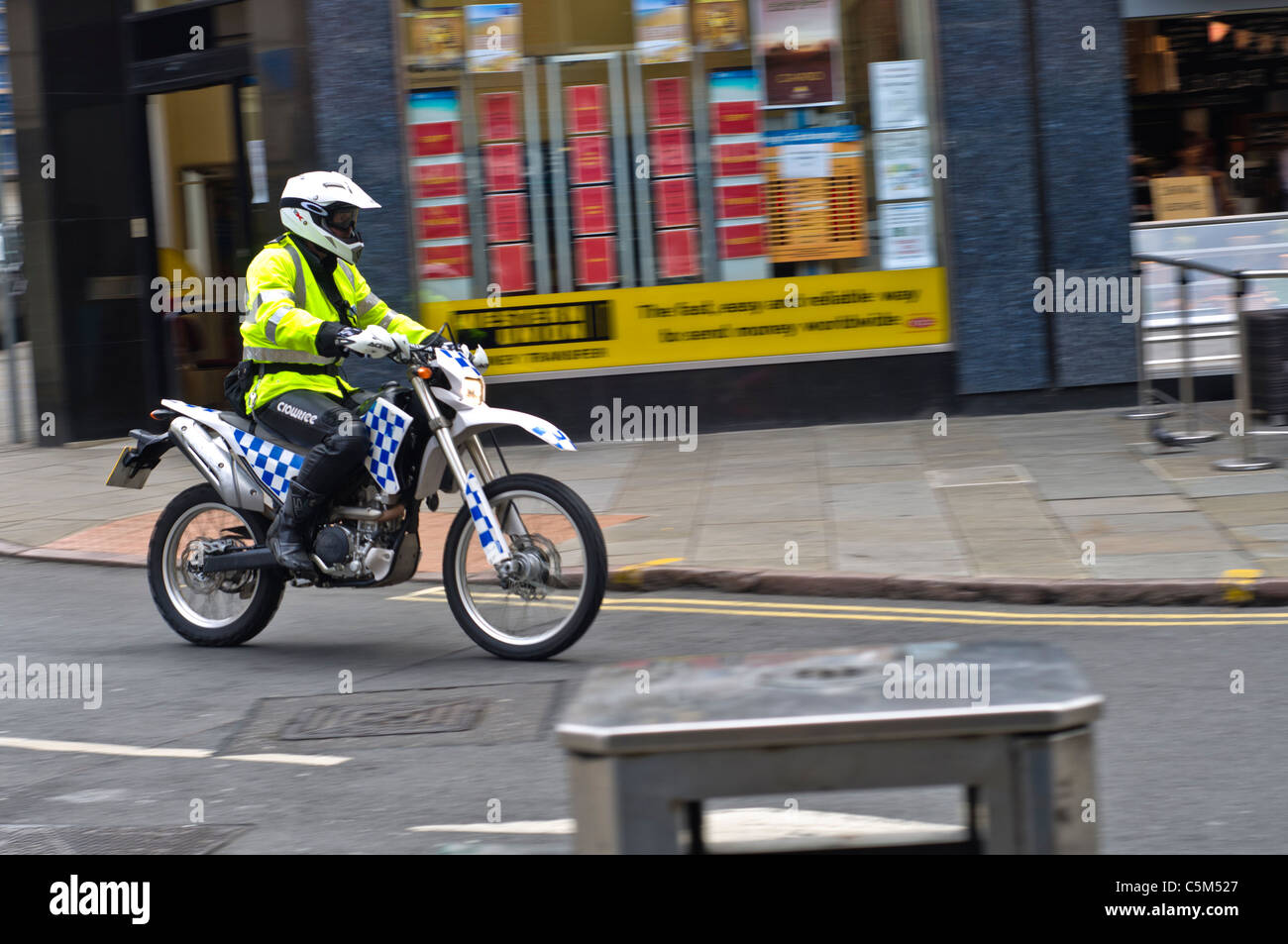 A Police Officer riding an off-road motorcycle in Nottingham City ...