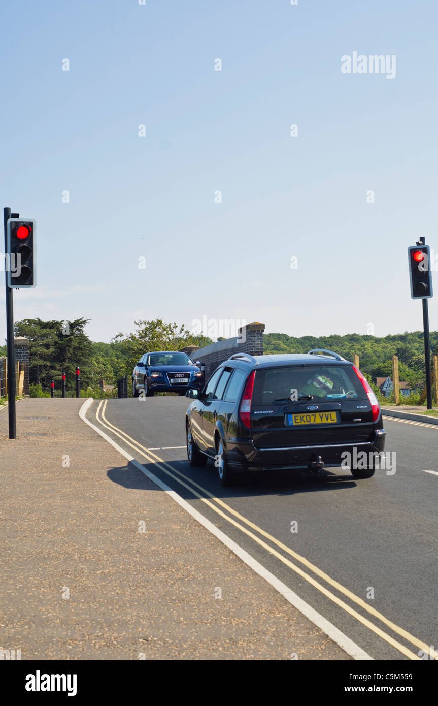 Cars on narrow bridge, controlled by traffic lights Stock Photo - Alamy