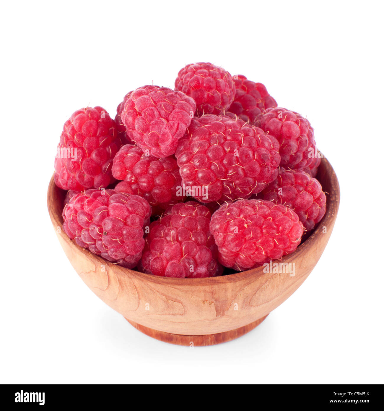 Wooden bowl full of fresh raspberry isolated on white background Stock ...
