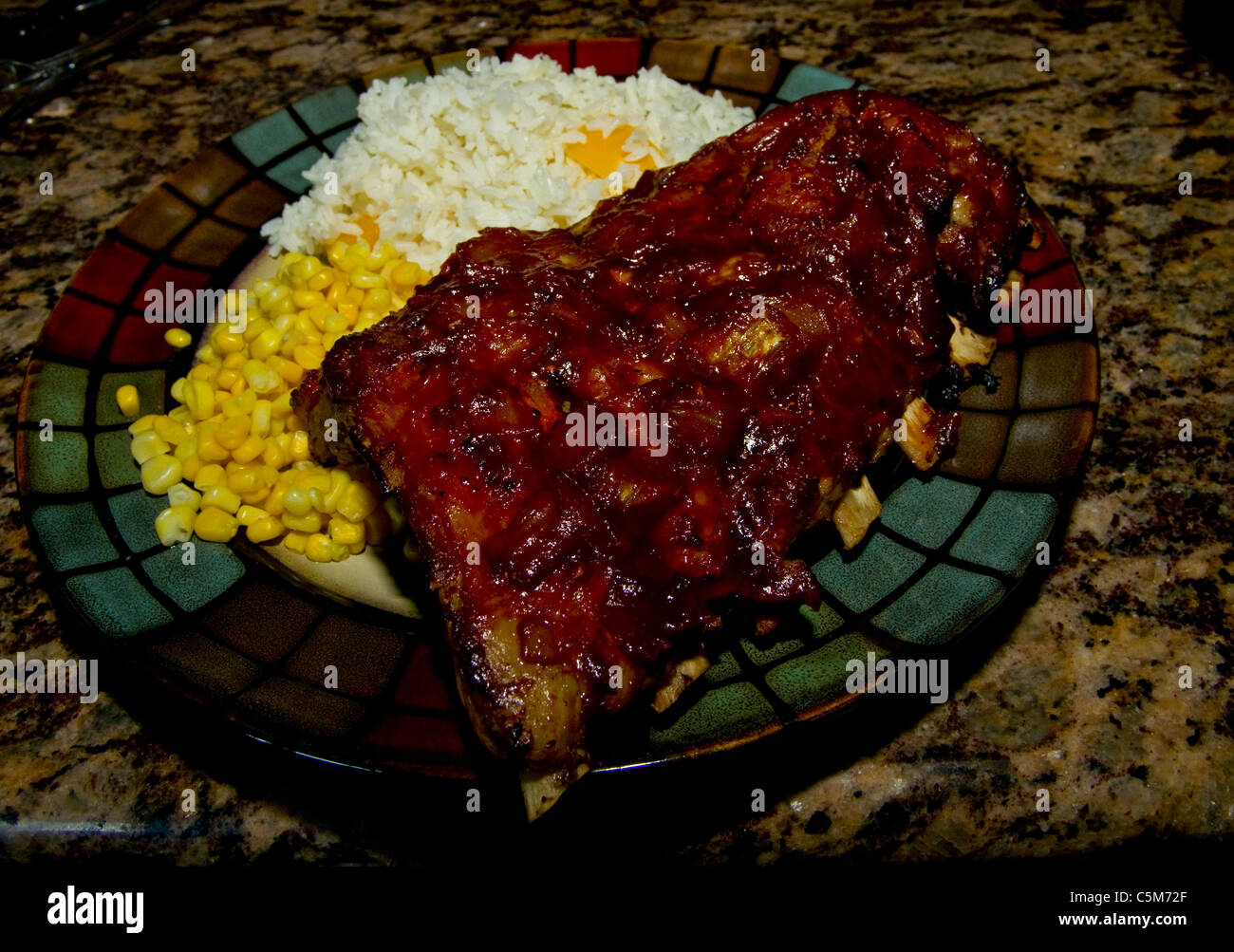 Barbecued pork back ribs being served on dinner plate Stock Photo - Alamy