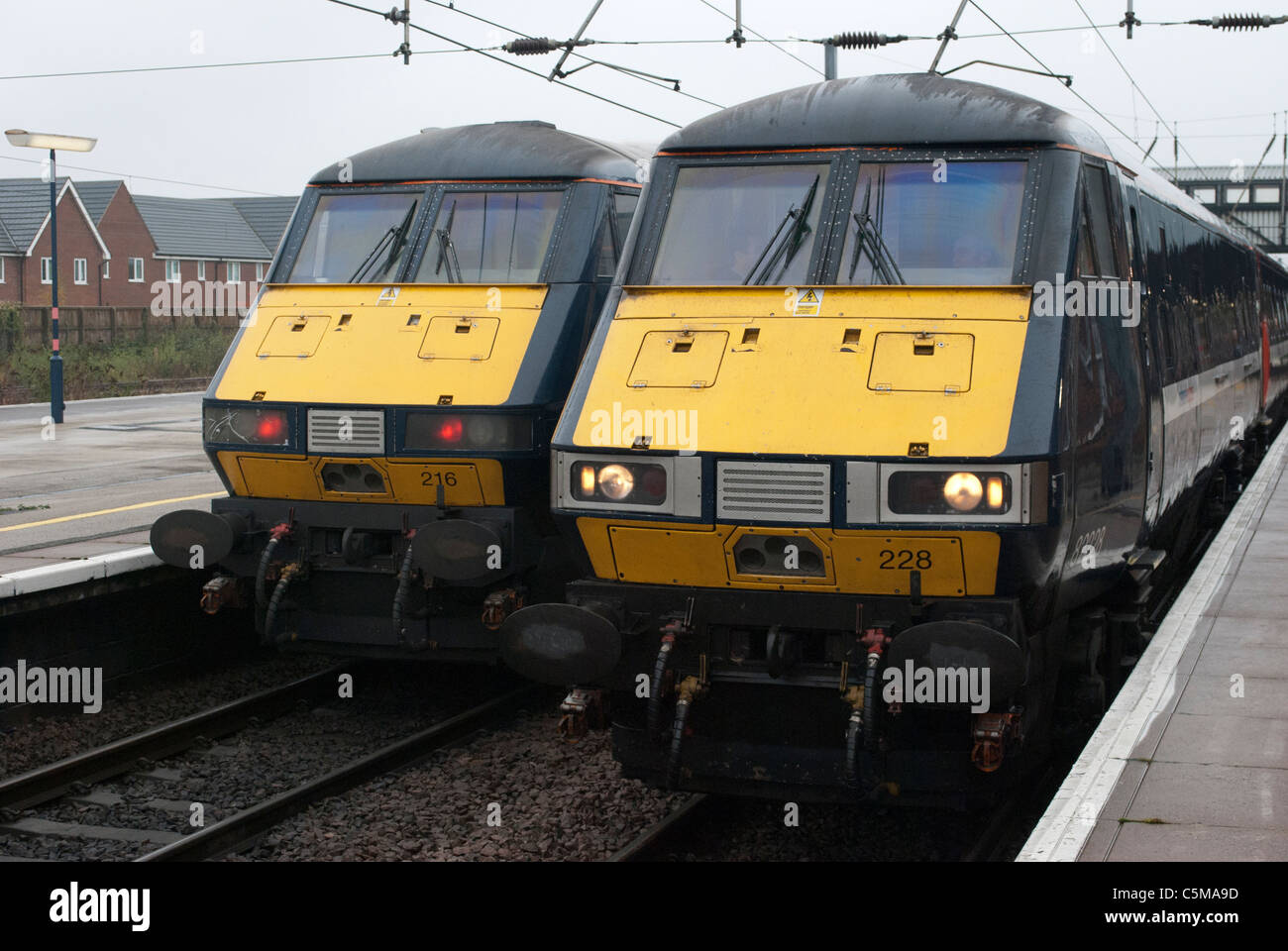 Two National Express trains at Grantham station on overcast day. East ...