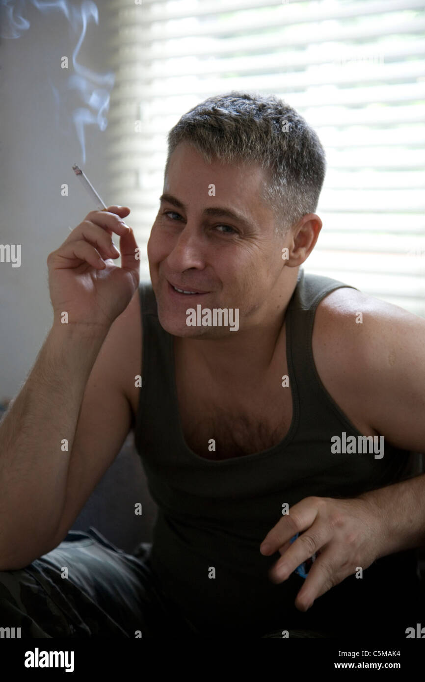 Middle age man smoking cigarette hi-res stock photography and images ...