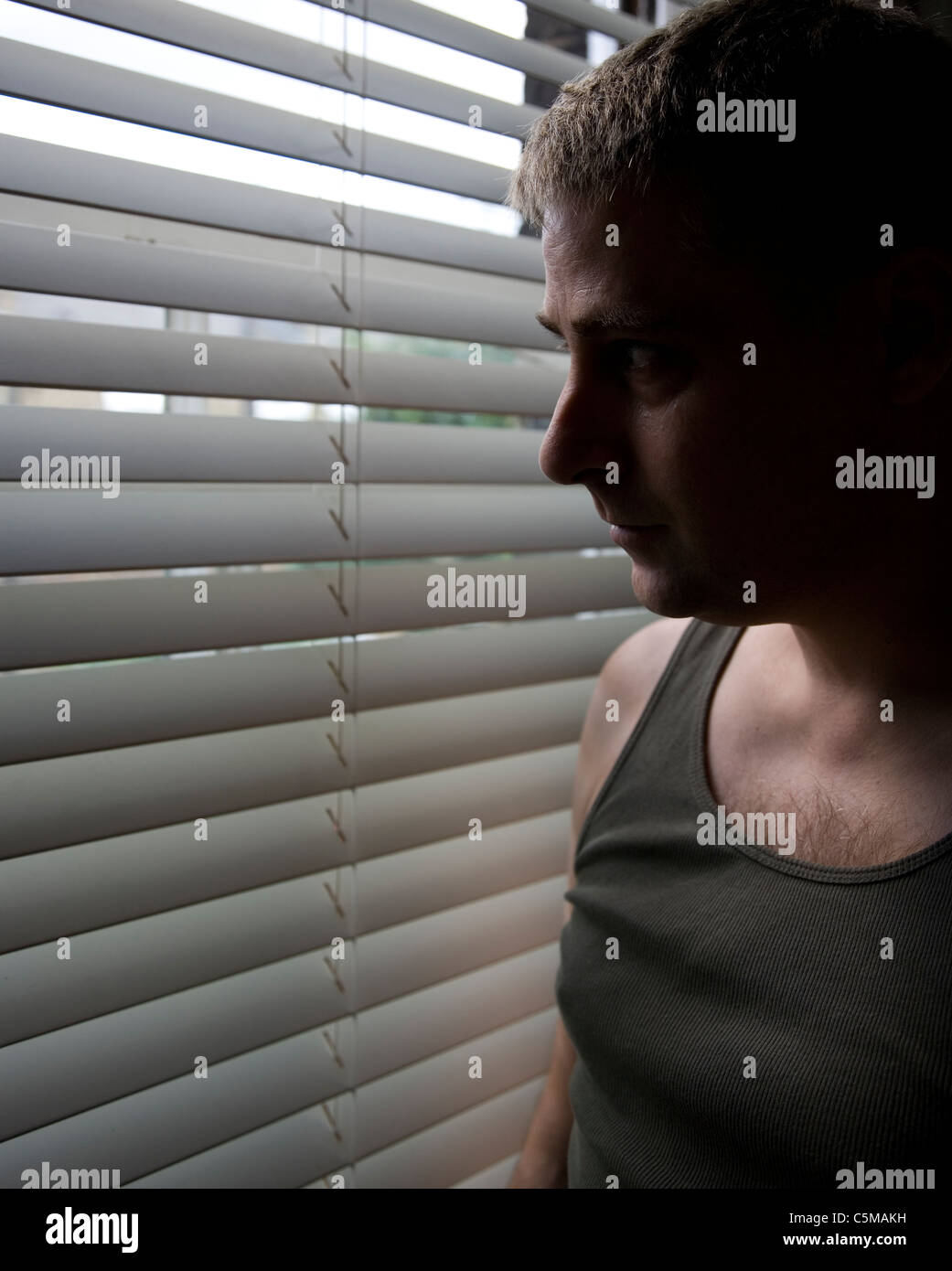Peeping through blinds hi-res stock photography and images - Alamy