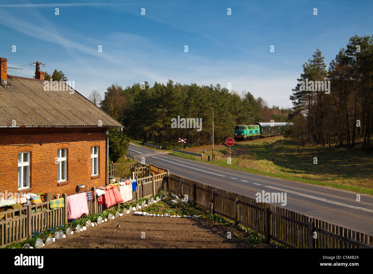 Passenger train passing through countryside Stock Photo - Alamy