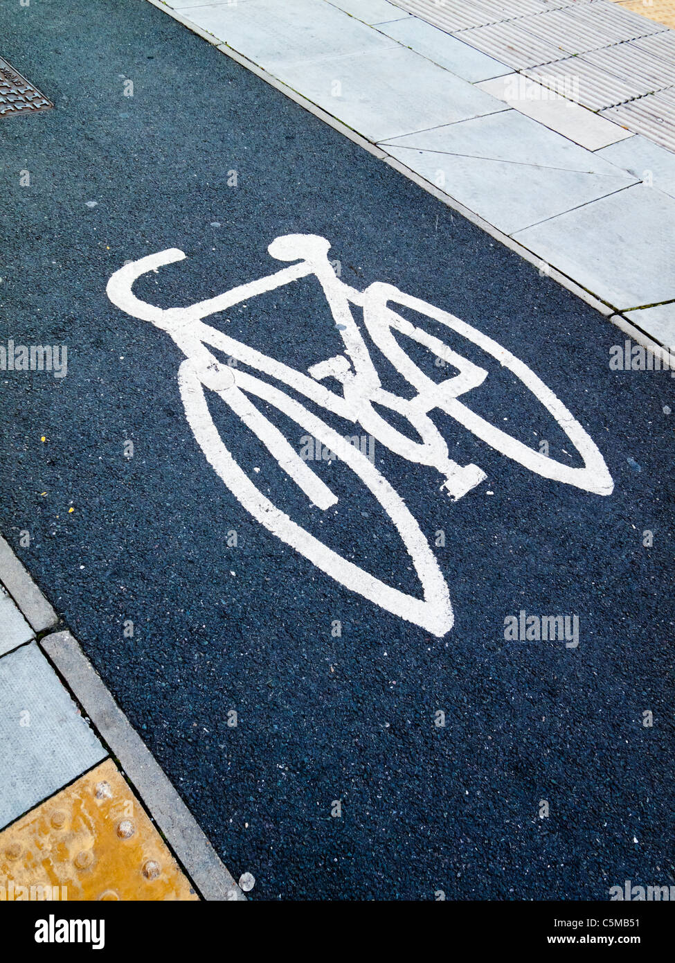 Cycle lane with bicycle painted onto tarmac in a town in the UK Stock ...