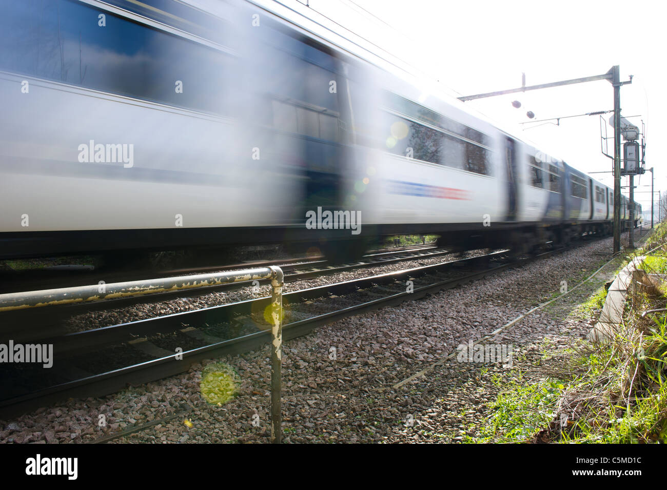 A train passing at speed captured with a slow shutter speed to enhance ...