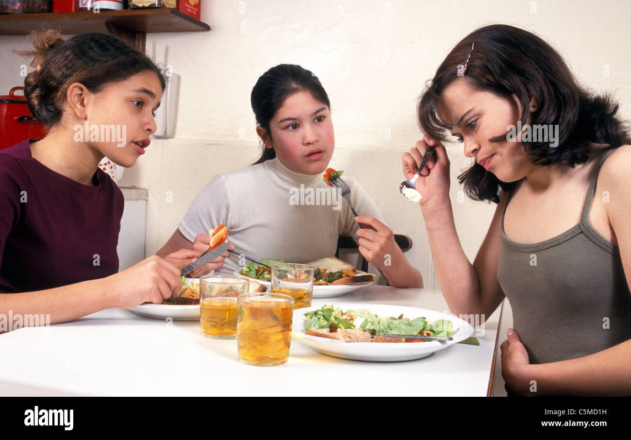 girl with eating disorder having meal with friends Stock Photo - Alamy
