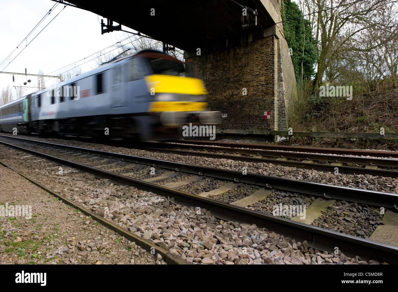 A train passing at speed captured with a slow shutter speed to enhance ...