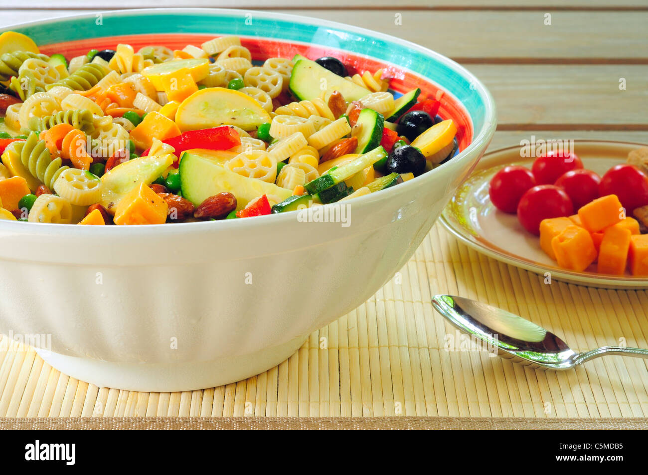 A delicious pasta salad on a picnic table Stock Photo - Alamy