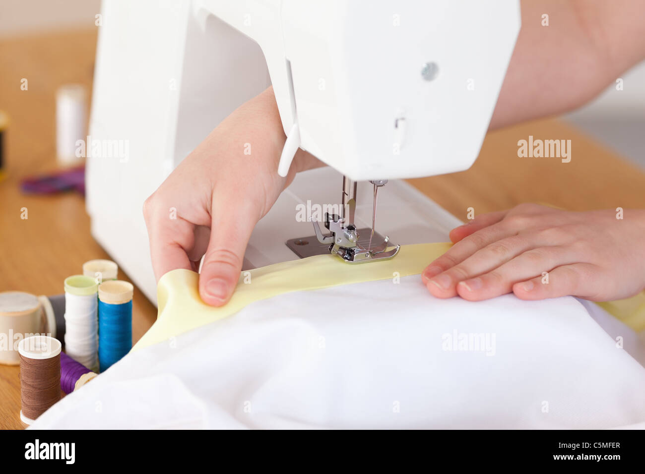 Using a sewing machine hi-res stock photography and images - Alamy