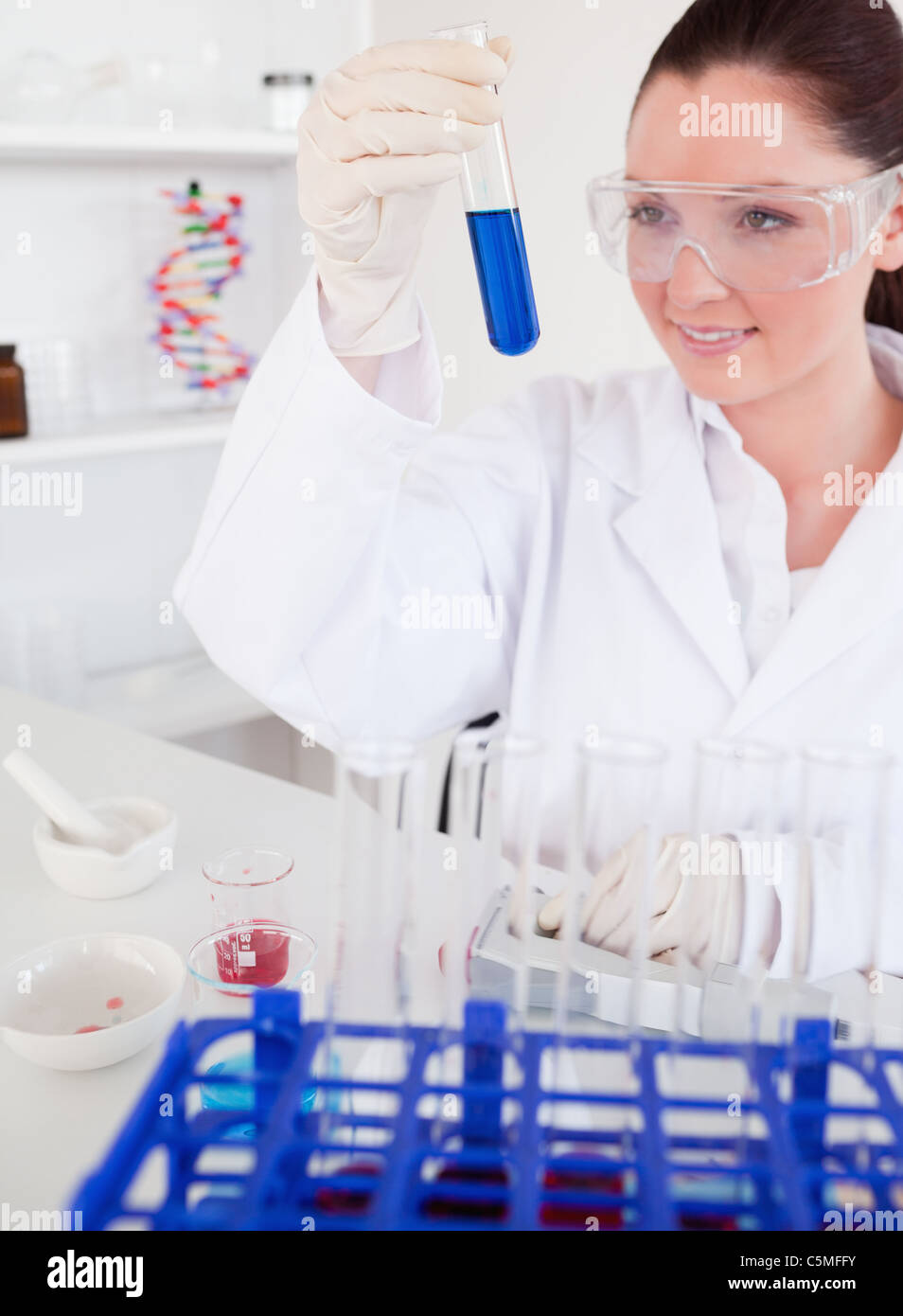 Attractive scientist holding test tube hi-res stock photography and ...
