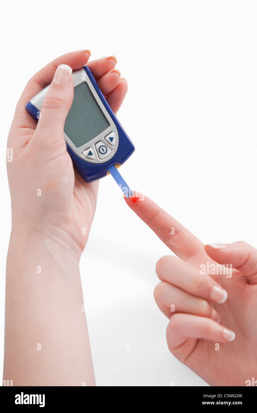 Portrait of the utilization of a blood glucose meter Stock Photo - Alamy