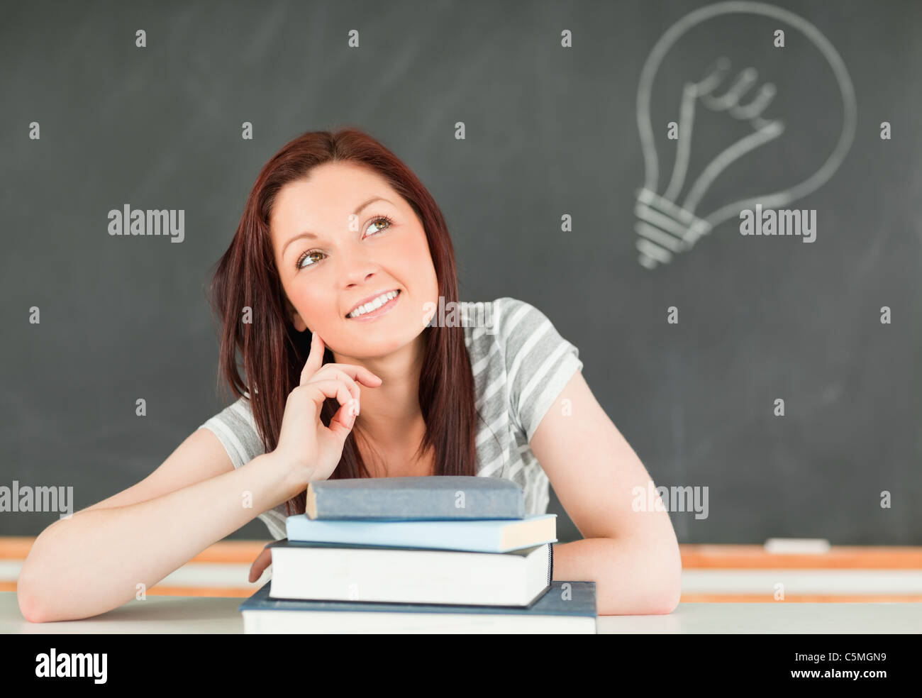 Smart young student in a classroom Stock Photo - Alamy