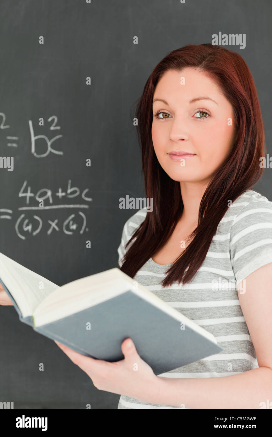 Portrait of a young woman trying to solve an equation Stock Photo - Alamy