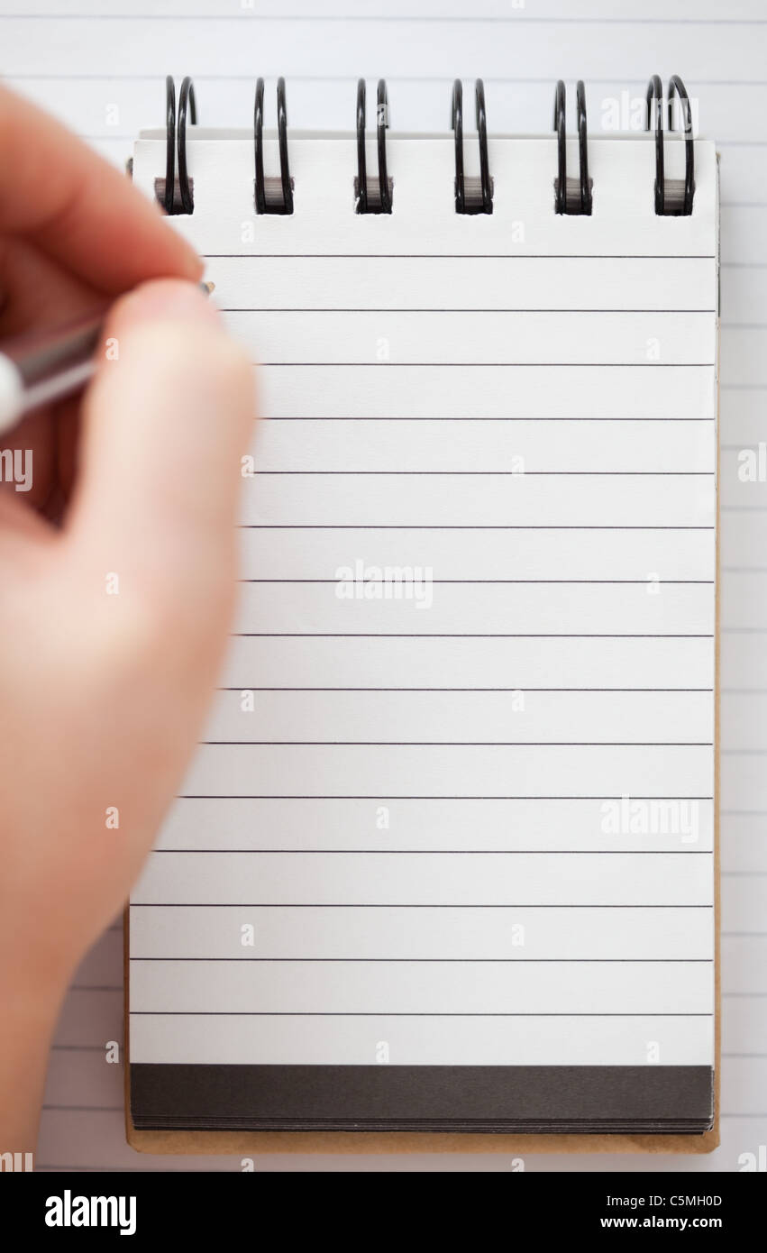 Woman hands writing on a notebook Stock Photo - Alamy