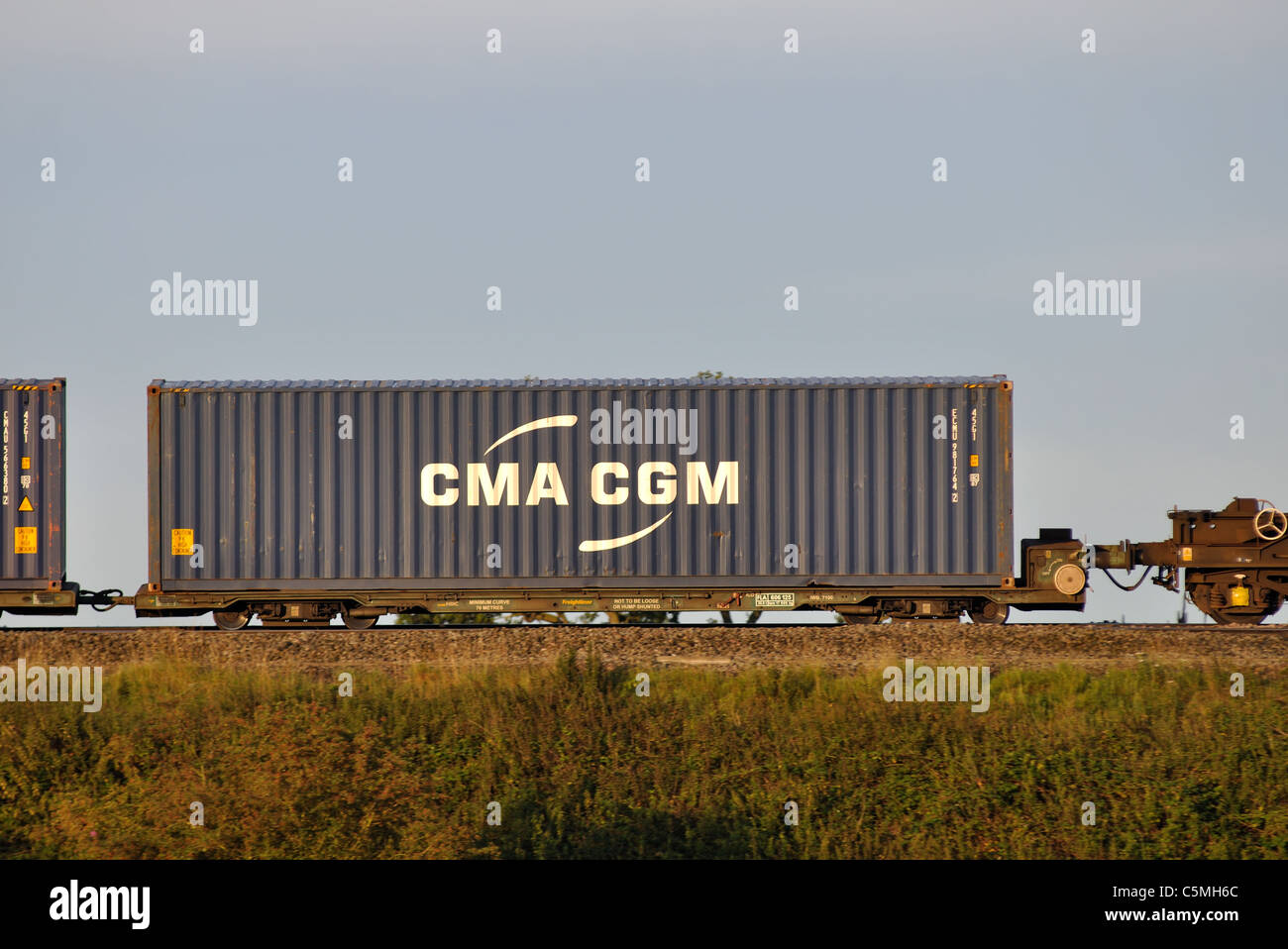 CMA CGM shipping container on a train, UK Stock Photo - Alamy