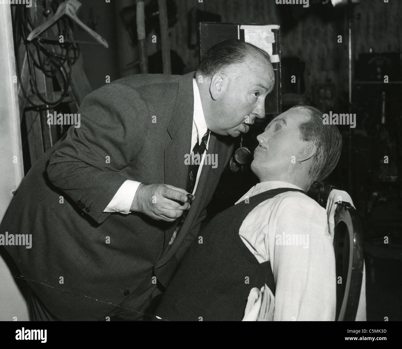 ALFRED HITCHCOCK with dummy on set of his film 'Dial M For Murder' in ...