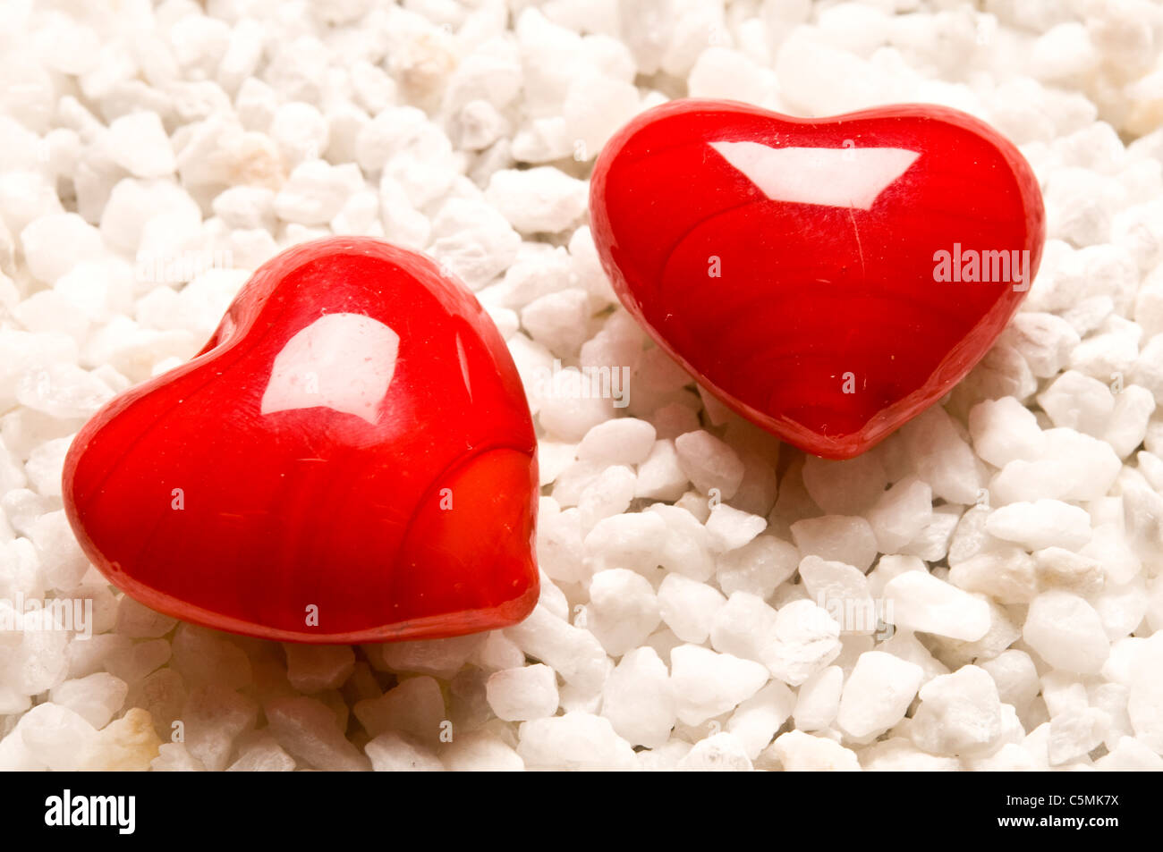 two heart shaped stones, love concept Stock Photo - Alamy