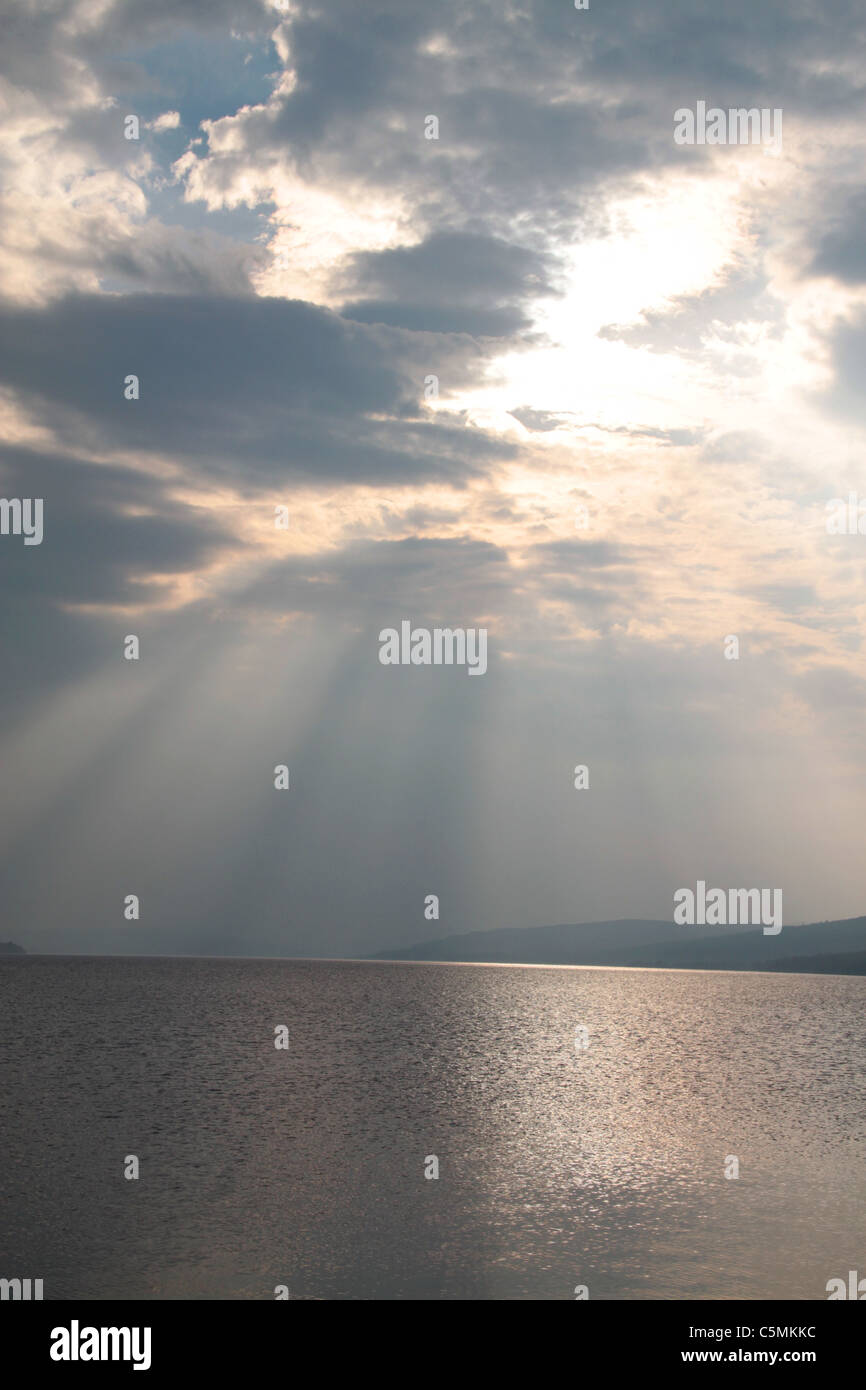 Sun streaming through the clouds, Loch Rannoch, Perthshire Scotland ...