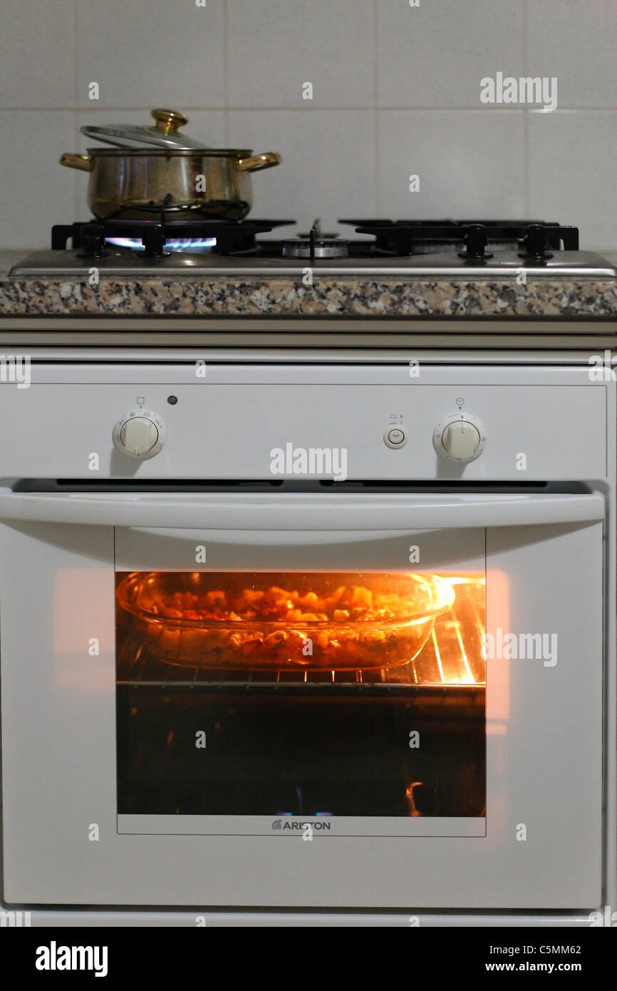 Food cooking in the oven Stock Photo - Alamy