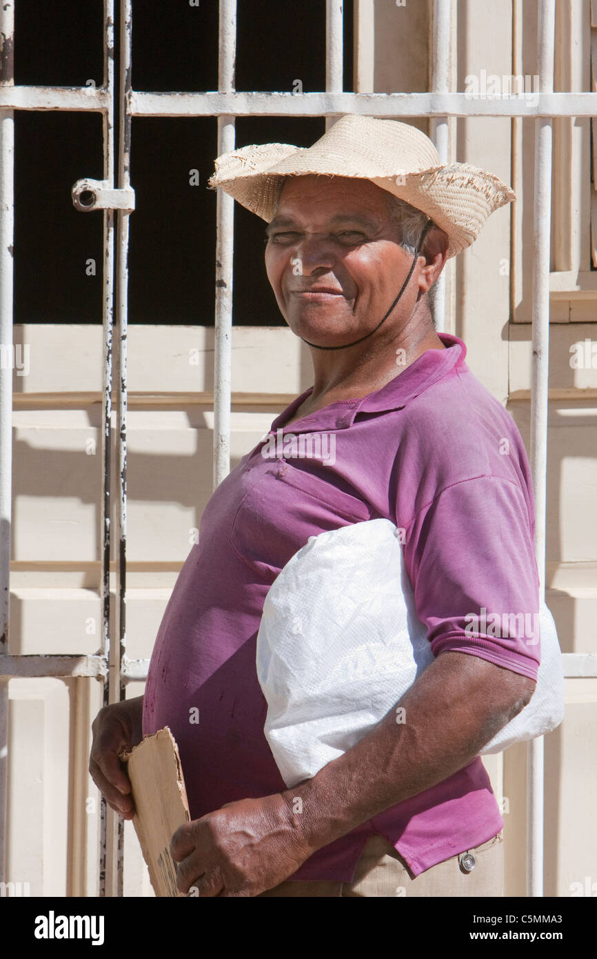 Cuba, Trinidad. Man Standing by Window Grille Stock Photo - Alamy