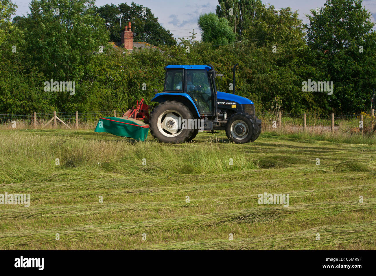 Mowing Hay with a New Holland TS90 4WD Tractor & a Kverneland Taarup ...