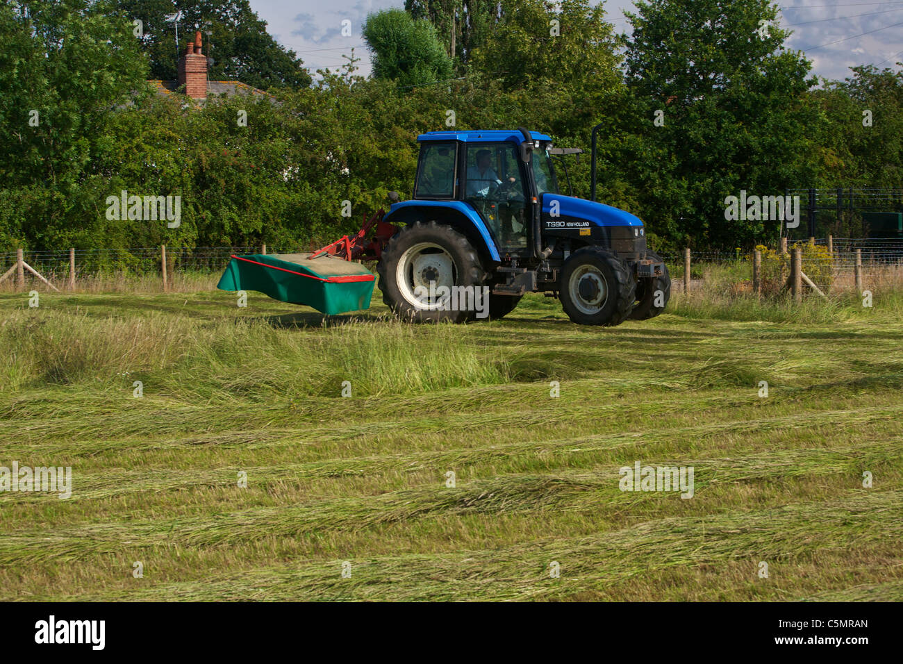 Mowing Hay with a New Holland TS90 4WD Tractor & a Kverneland Taarup ...
