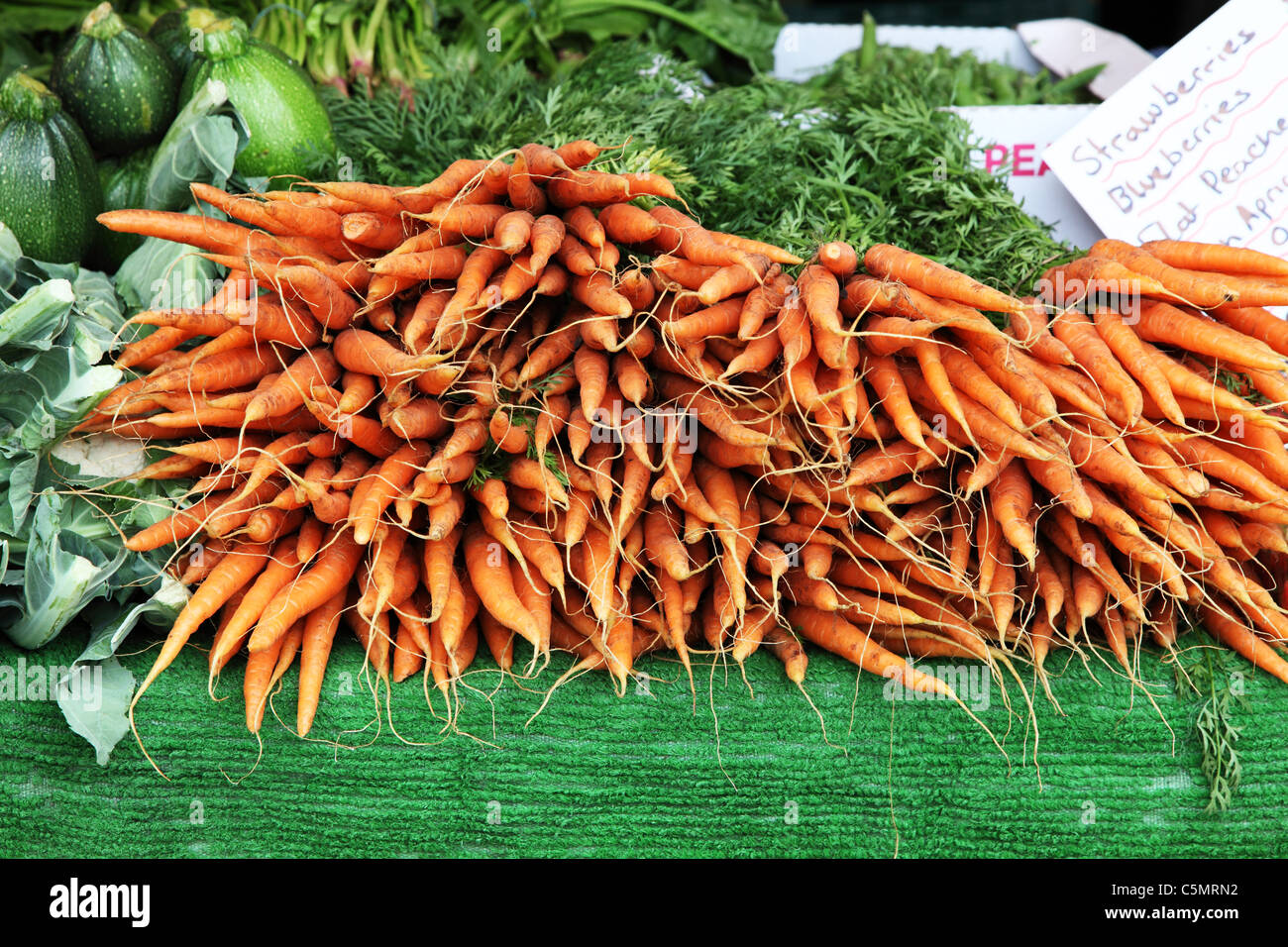 Carrots on market traders stall Stock Photo - Alamy
