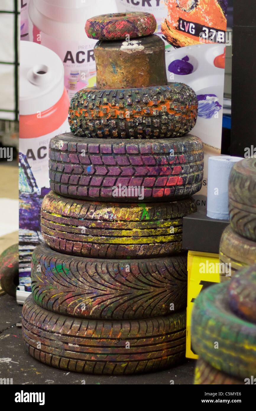A Stack of Tires Painted in different colours Stock Photo - Alamy