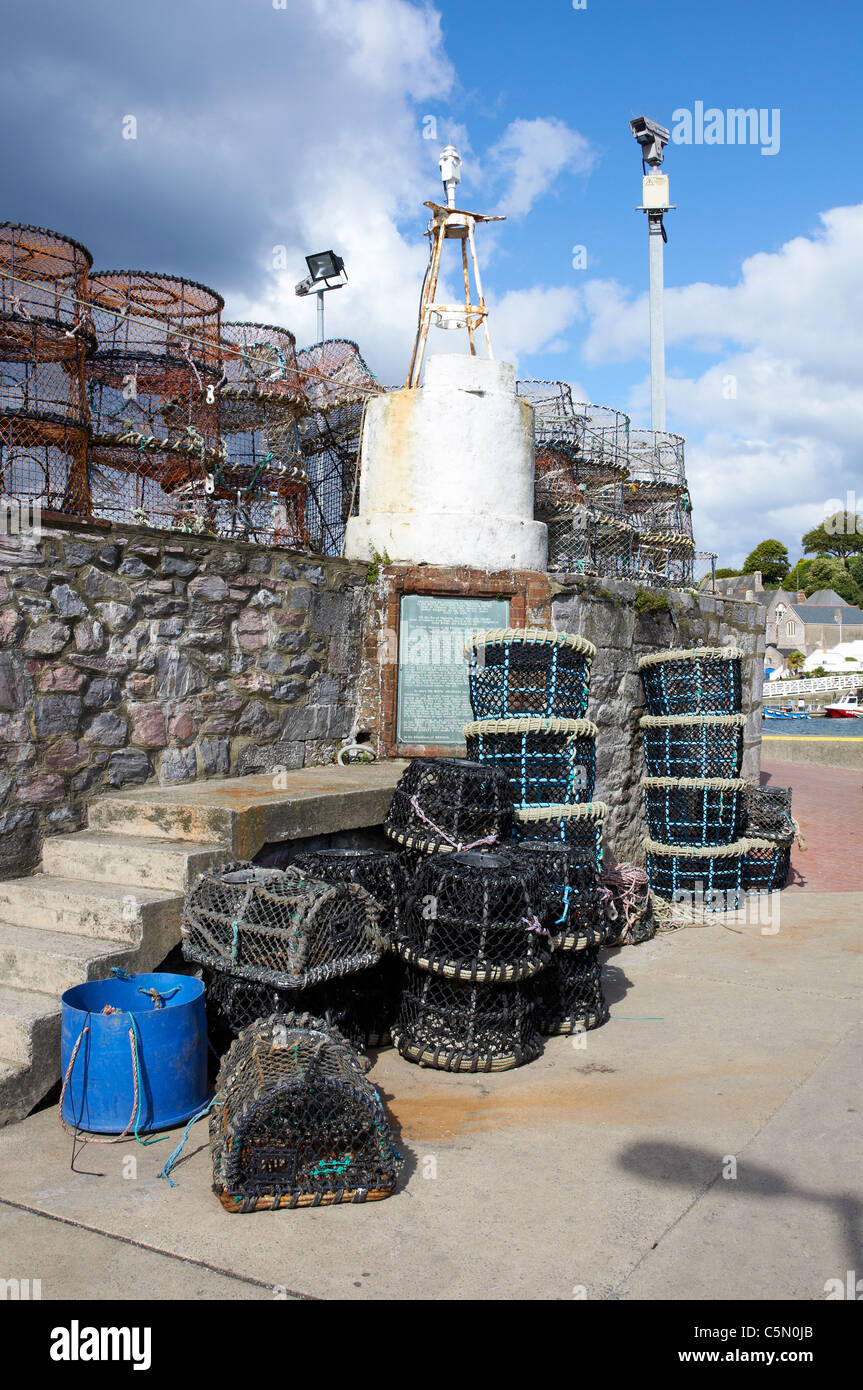 Lobster and crab pots stacked on the quayside at Brixham harbour in ...