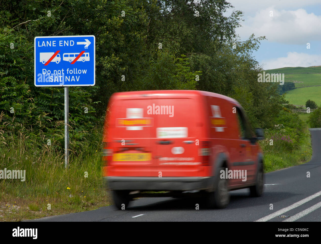 Van passing road sign warning drivers of lorries and buses to ignore ...