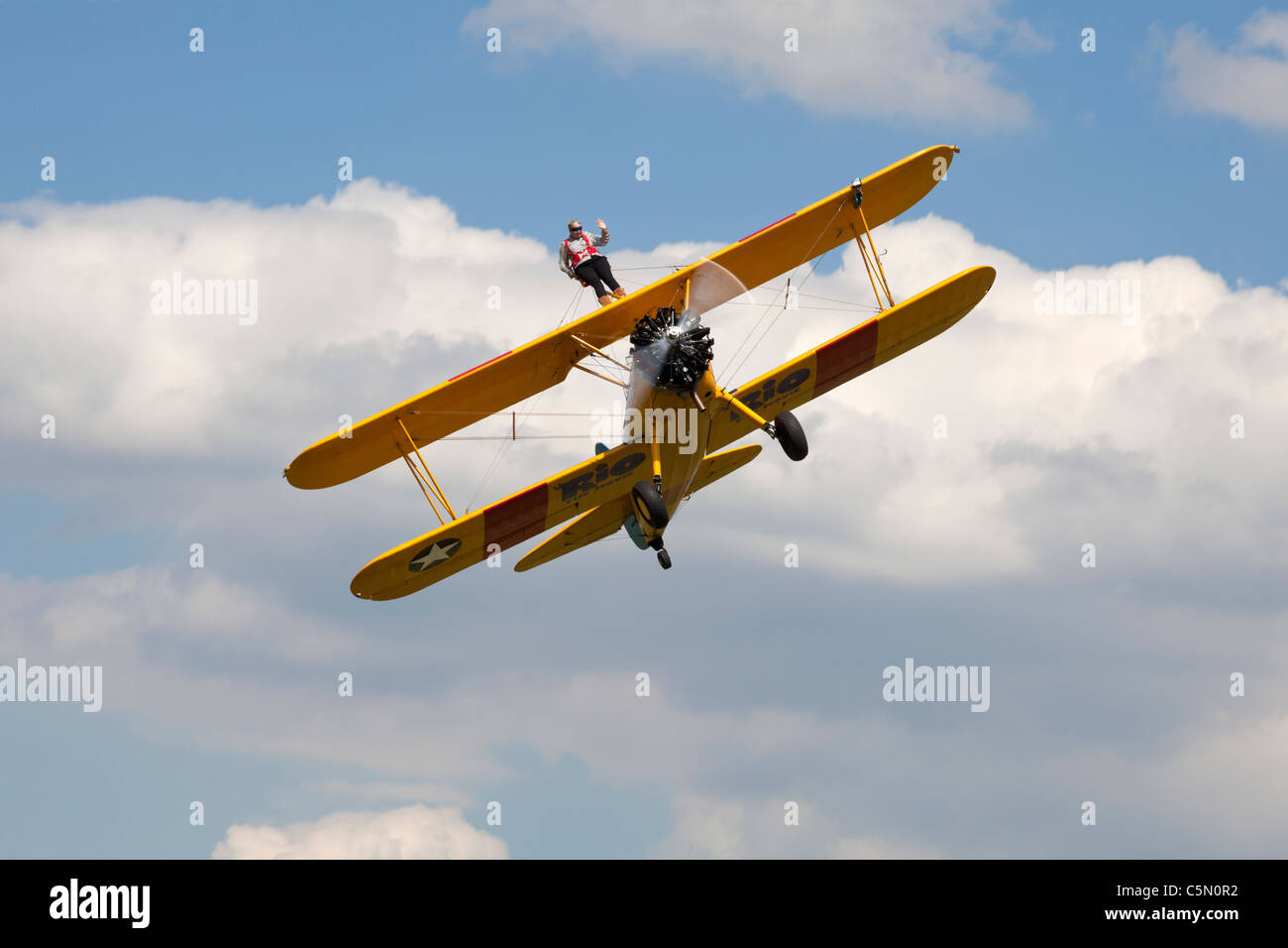 Boeing Stearman A75L300 Kaydet G-CGPY in flight with wing-walker on ...