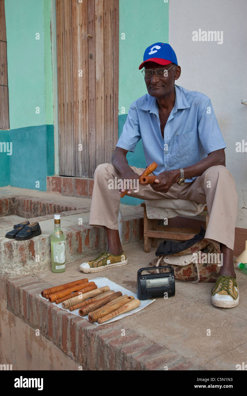 Cuba, Trinidad. Afro-Cuban Vendor of Wooden Percussion Instruments ...