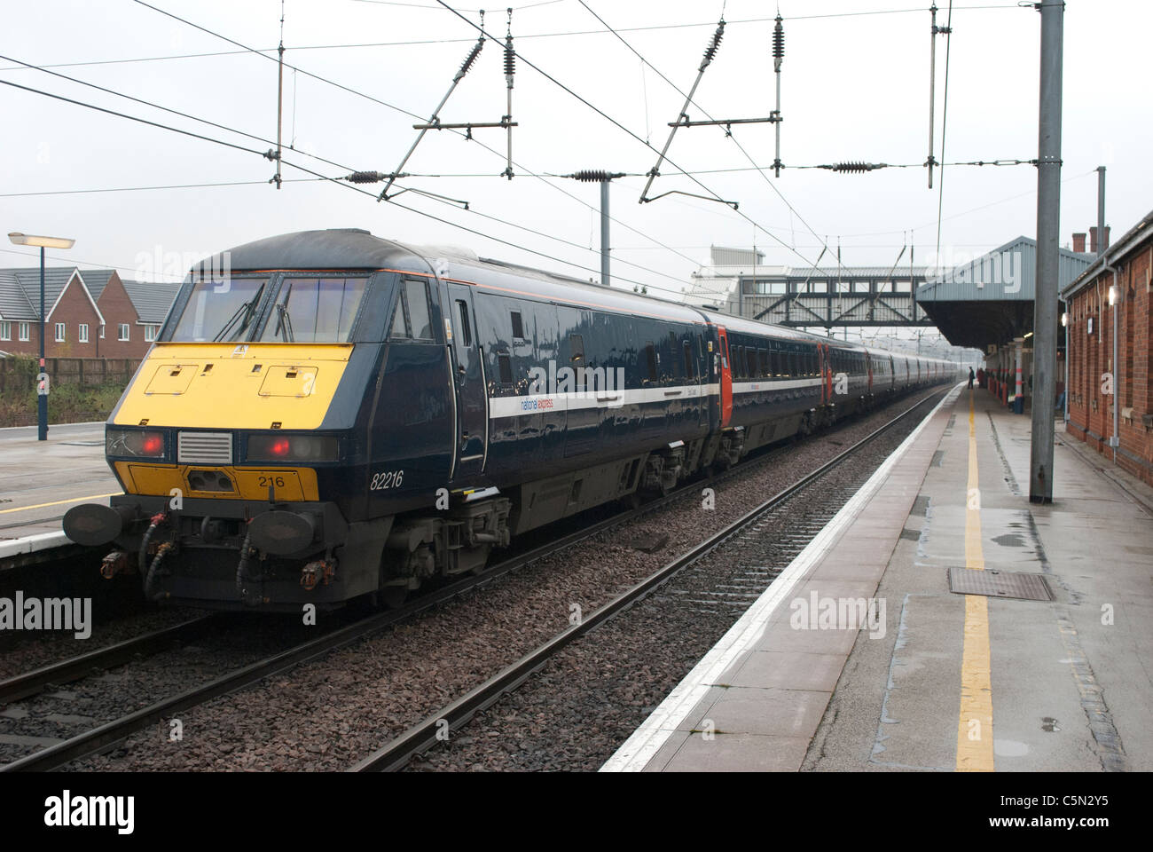 National Express train at Grantham station on overcast day. East Coast ...