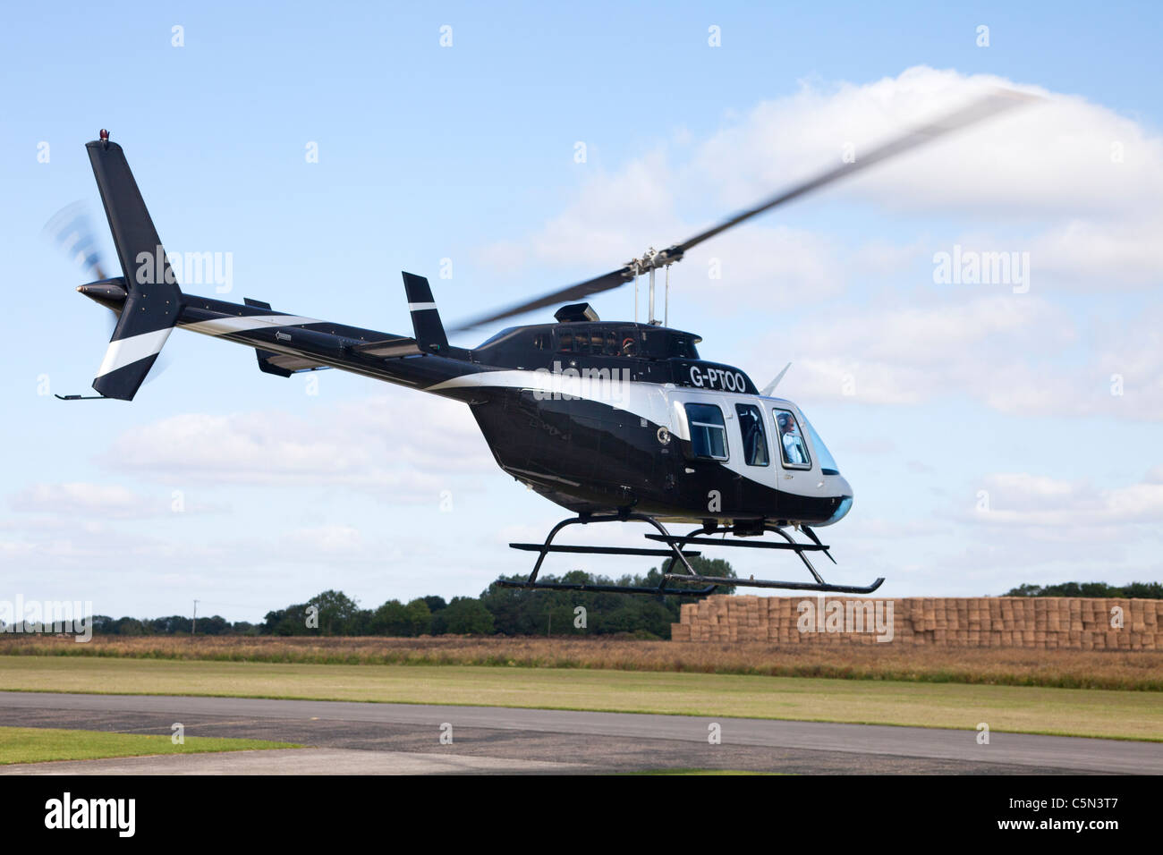 Bell 206L-4 Longranger IV G-PTOO in flight taking-off Stock Photo - Alamy