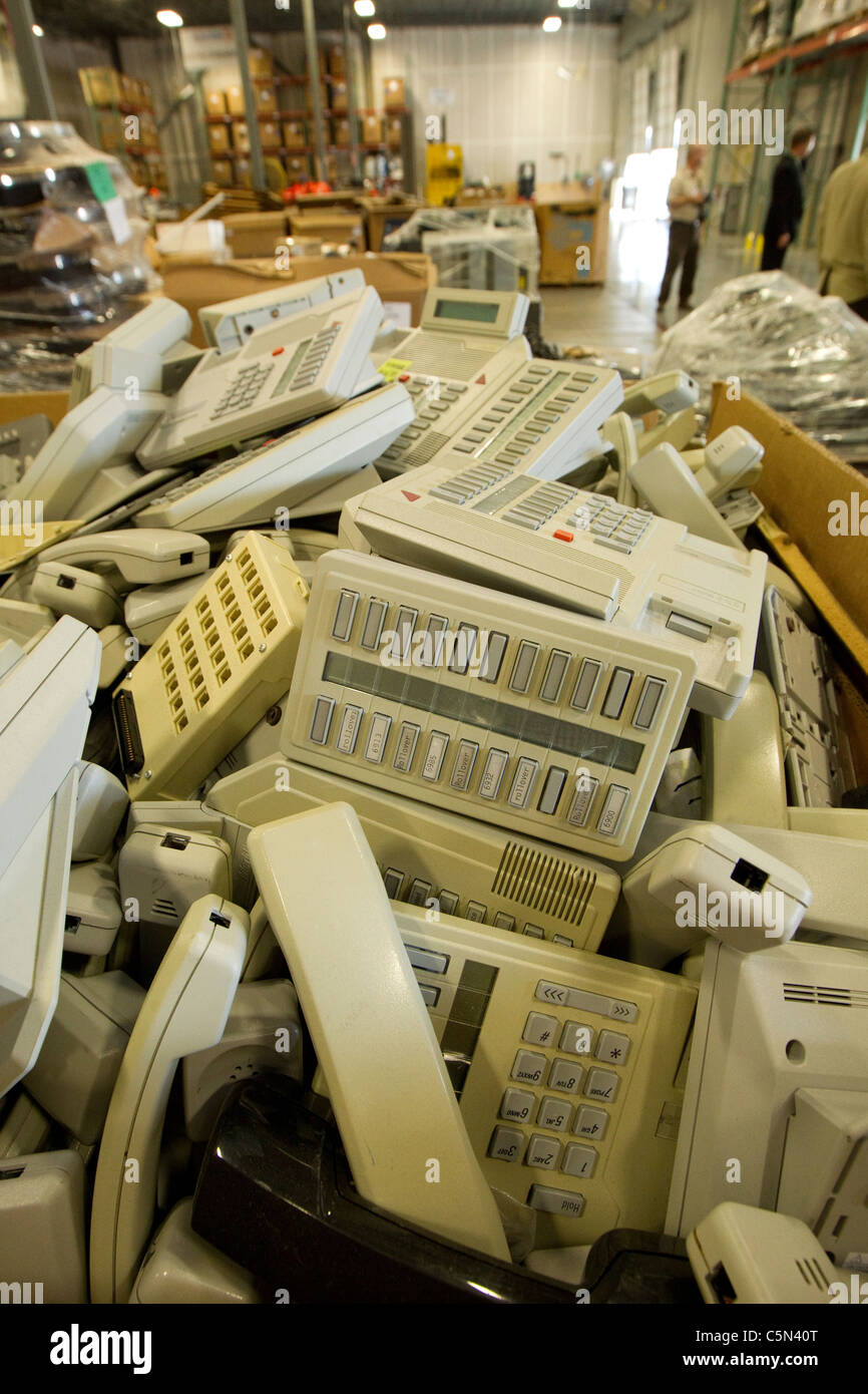Piles of outdated electronics, phone systems and high-tech devices are ...