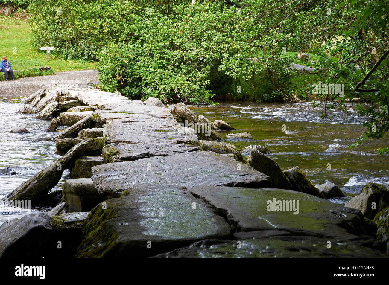 Tarr Steps a medieval clapper bridge across the River Barle near ...