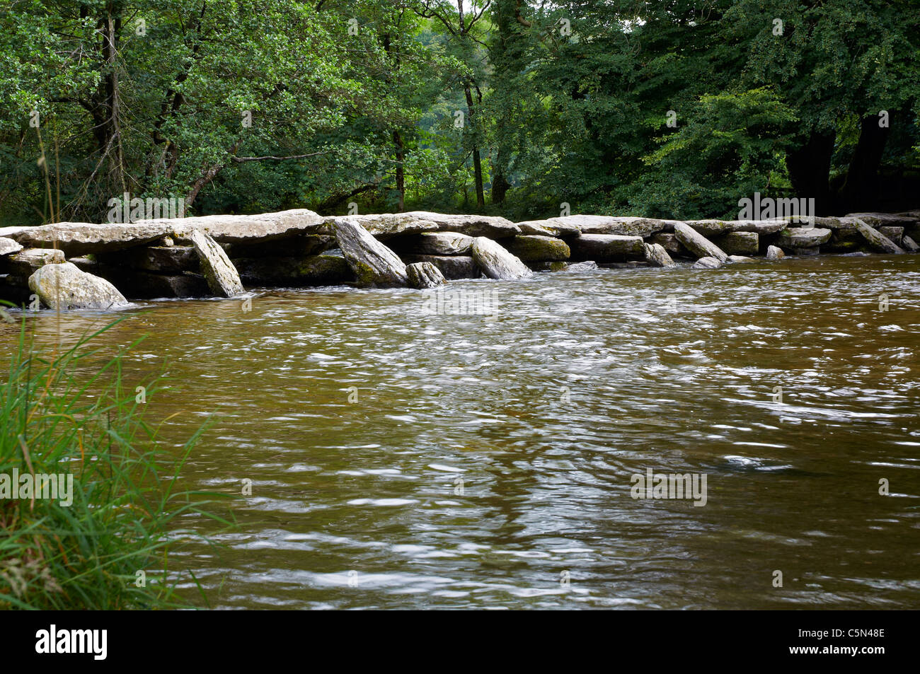 Tarr Steps a medieval clapper bridge across the River Barle near ...
