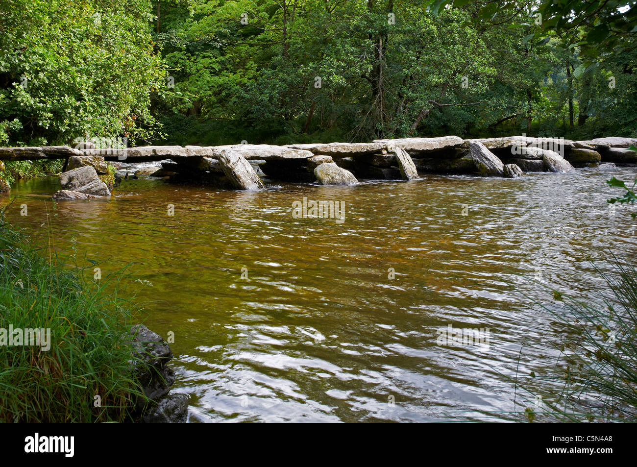 Tarr Steps a medieval clapper bridge across the River Barle near ...
