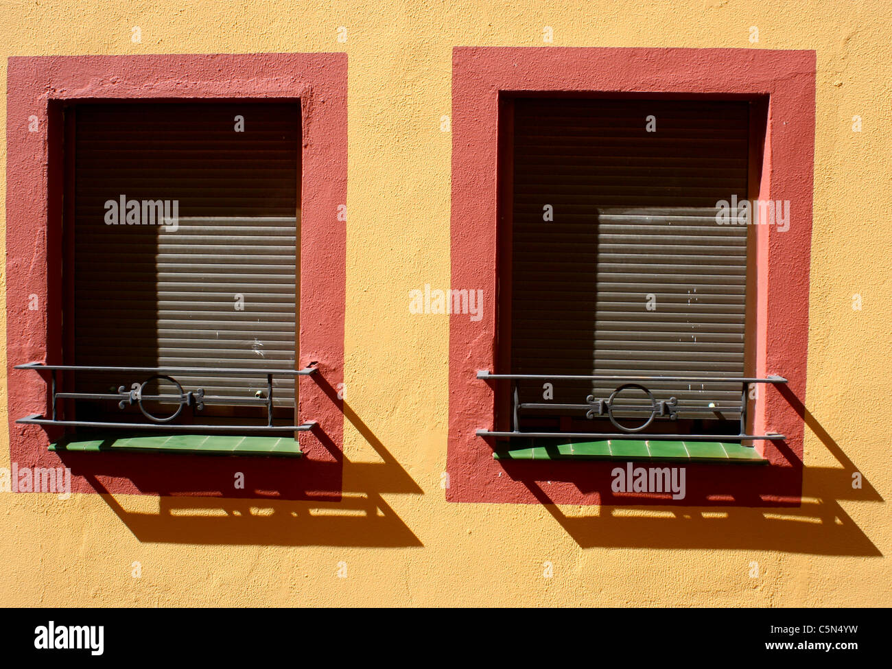 Brightly painted windows, Seville Stock Photo - Alamy