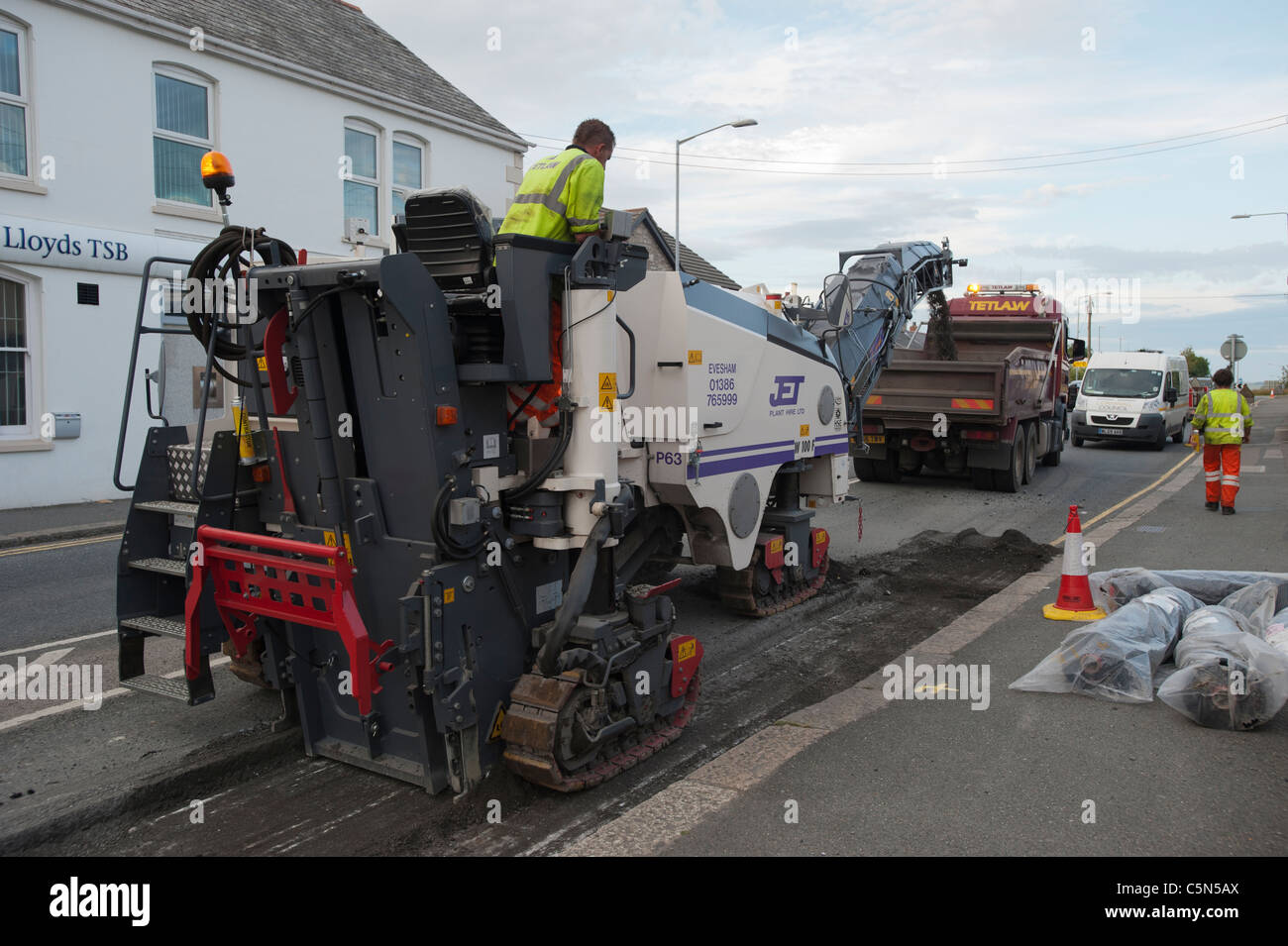 Re-surfacing work being carried out on a road junction Stock Photo - Alamy