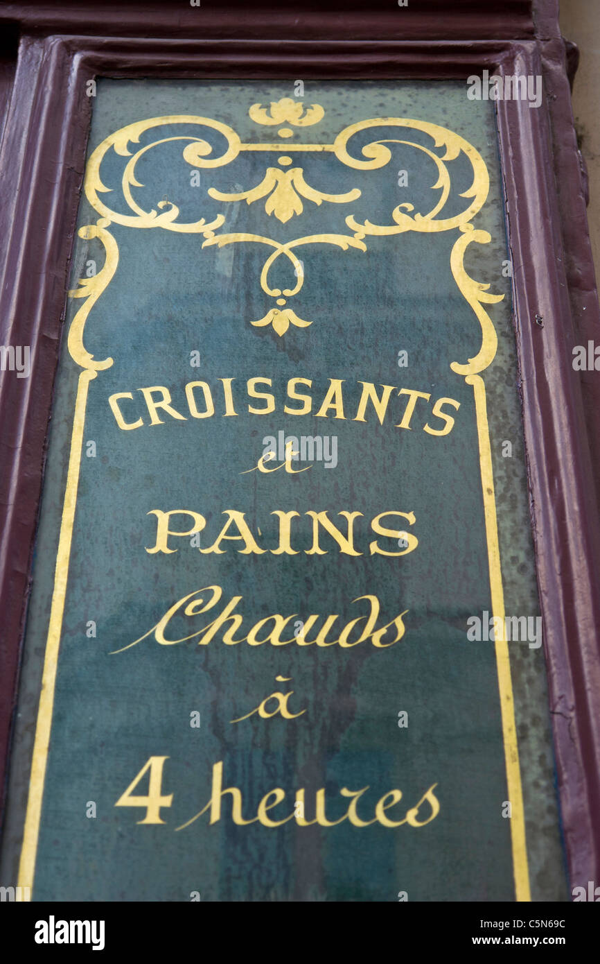 Old boulangerie sign telling customer of warm bread and croissants at 4 ...