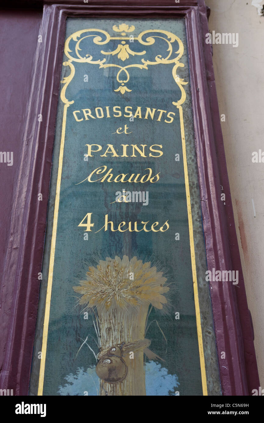 Old boulangerie sign telling customer of warm bread and croissants at 4 ...