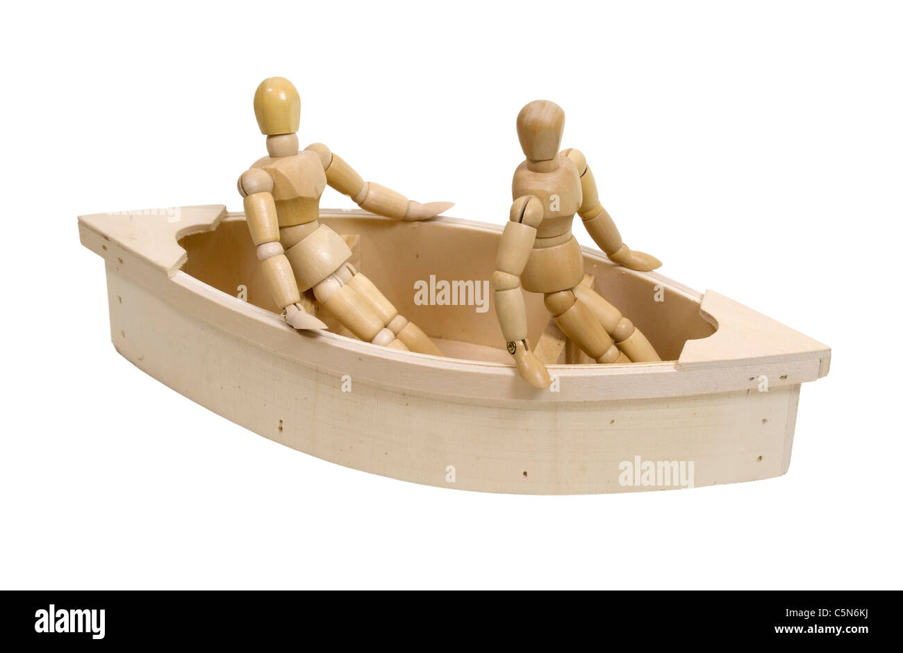 Wooden models representing people relaxing in a boat - path included ...